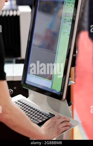 The technician operator working with sheet metal on CNC hydraulic press ...