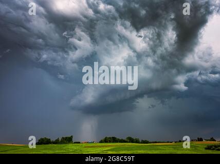 Extreme thunderstorm supercell with white hail core, hail falling on a ...