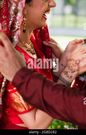 Laughing Indian couple at wedding Stock Photo - Alamy