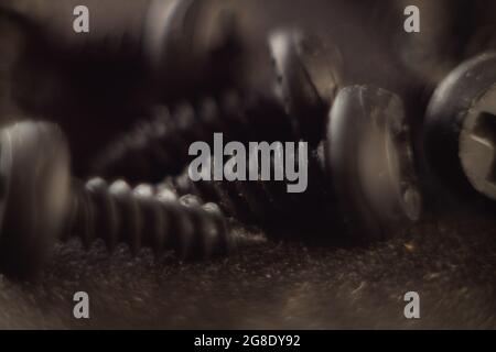 Closeup shot of different screws and bolts on a rough surface Stock ...
