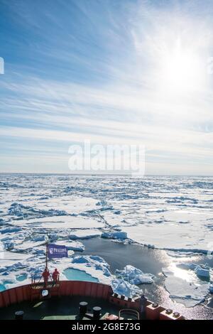 People enjoying the breaking ice on board of an icebreaker, North Pole ...