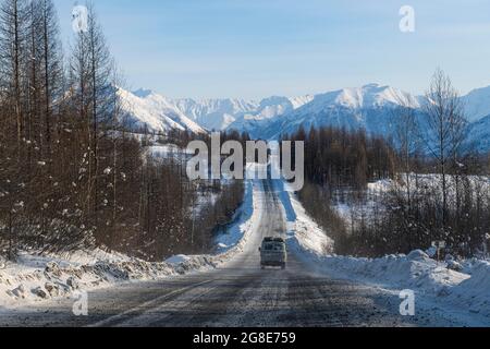 Minivan driving on the Road of Bones, Suntar-Khayata Range, Sakha ...
