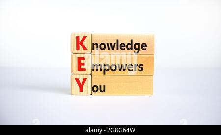 KEY, knowledge empowers you symbol. Wooden blocks with words 'KEY ...