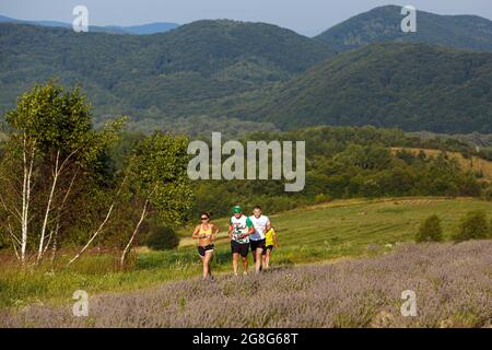 Non Exclusive: PERECHYN, UKRAINE - JULY 16, 2021 - A runner jogs along ...