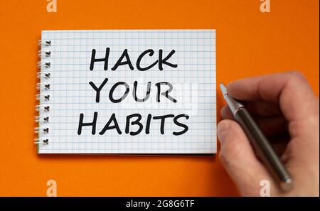 Hack your habits symbol. Businessman writing words 'Hack your habits ...