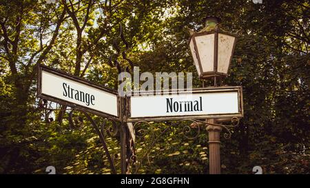 Street Sign the Direction Way to Normal versus Strange Stock Photo - Alamy
