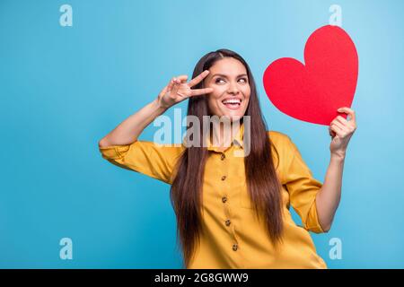 Photo portrait of brunette girl curious pointing finger blank space ...