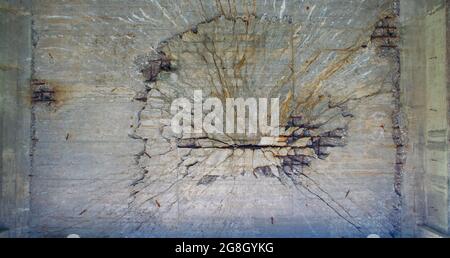 Crack in a concrete massive crack. Something exploded on the other side ...