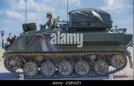 British army FV432 Bulldog armored personnel carrier in action on a ...