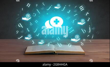 Open medical book with health icons above Stock Photo - Alamy