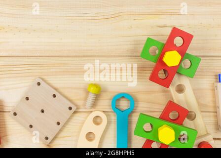 A colorful wooden building kit, plane for children on wood. Set of ...