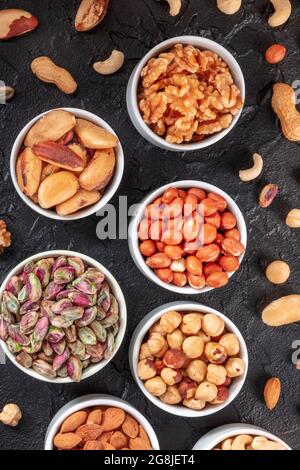 Nuts variety. Many different nuts, shot from the top on a vibrant blue ...