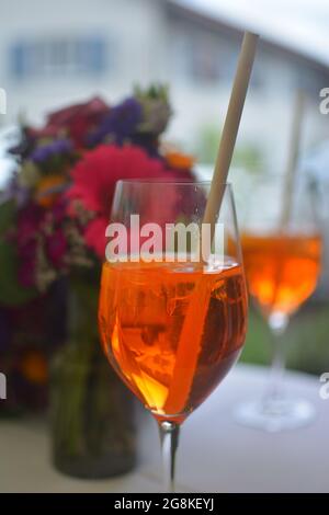 Aperol Spritz in front of a white background Stock Photo - Alamy