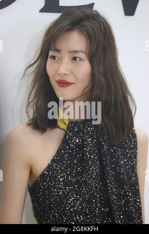 Chinese model Liu Wen wears hanging sequins dress attending Loewe ...