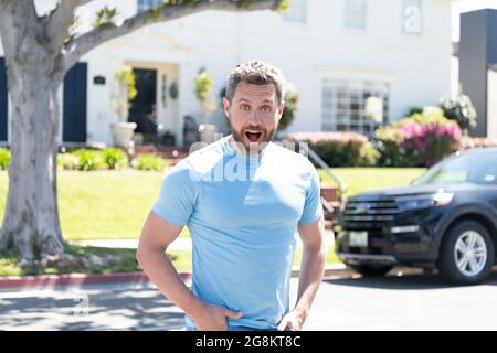surprised handsome bearded guy with unshaven face and stylish hairdo ...