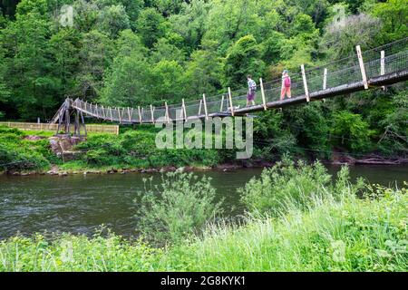 A suspension bridge at the Biblins, a youth campsite on the River Wye ...