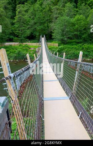 A suspension bridge at the Biblins, a youth campsite on the River Wye ...