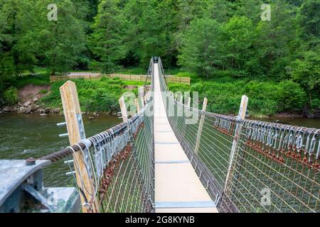 A suspension bridge at the Biblins, a youth campsite on the River Wye ...
