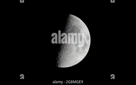 Half moon first quarter seen with astronomical telescope Stock Photo ...