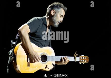 Singer Jorge Drexler plays a guitar during a music concert at the ...