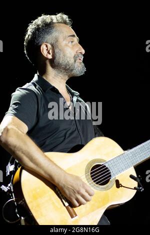 Singer Jorge Drexler plays a guitar during a music concert at the ...