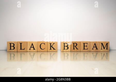 Black pepper word created from wooden letter cubes. Gastronomy and ...