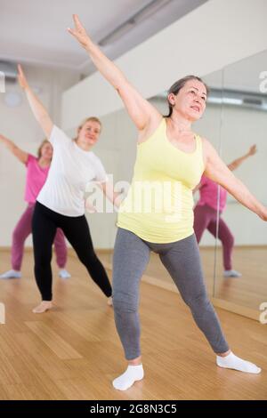 Mature women dancing aerobics at lesson in dance class Stock Photo - Alamy