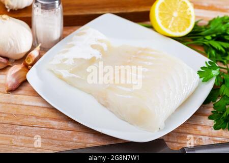 Raw pink cusk-eel fish fillet, seafood ingredients Stock Photo - Alamy