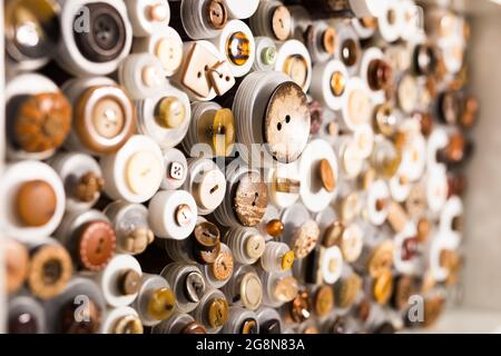 Buttons in tubes on store shelves Stock Photo - Alamy