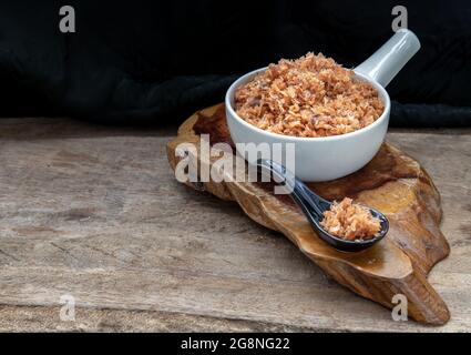 Shrimp paste with Dried shrimps in white Ceramic Bowl on Wooden plank ...