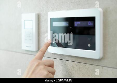 hand checking power consumption rate Stock Photo - Alamy
