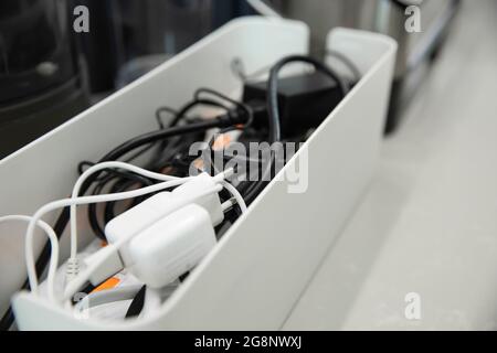 tangled plug lines and power strip Stock Photo - Alamy