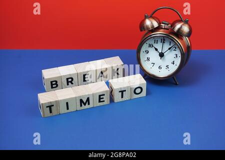 Time to Break alphabet letters and alarm clock on blue background Stock ...