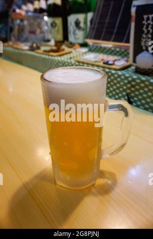Draft beer and yakitori at a Japanese izakaya Stock Photo - Alamy