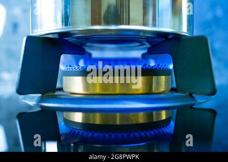 Open the gas valve and put the pot on the stove Stock Photo - Alamy