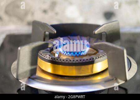 Open the gas valve and put the pot on the stove Stock Photo - Alamy