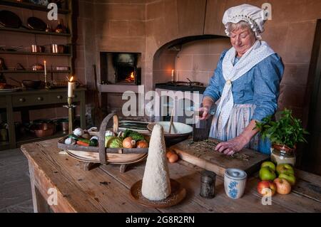 The Georgian kitchen of Paxton House with the Cook hard at work Stock ...