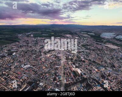 The cityscape of Turks Bagua City in China at dusk. Shot in Xinjiang ...