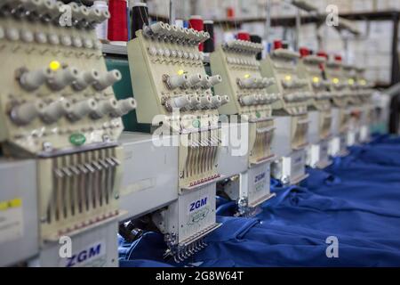 sewing machines on going Stock Photo - Alamy