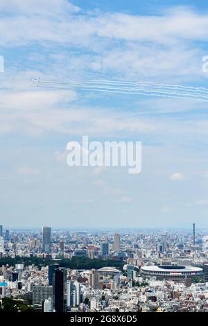 The Blue Impulse aerobatic team performs a flyover over the Tokyo ...