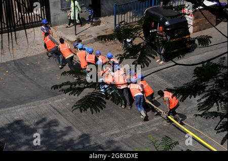 workers Pulling a fiber optic cable for fast internet and telephone ...