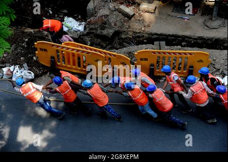 workers Pulling a fiber optic cable for fast internet and telephone ...