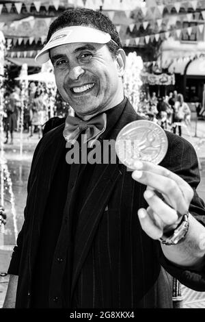 Portrait of a street magician performing tricks with cards Stock Photo ...