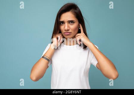 Portrait of sad touchy resentful young pretty nice brunette woman with ...