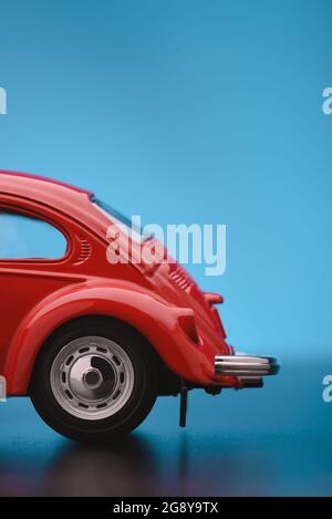Close up shot of a Partial Backside of a red colored toy model car on a ...