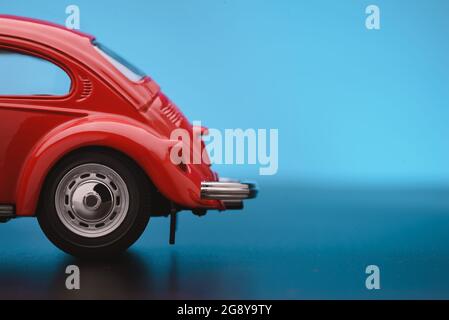 Close up shot of a Partial Backside of a red colored toy model car on a ...