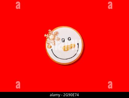 Snowflake shaped Christmas cookie against vibrant red background Stock ...