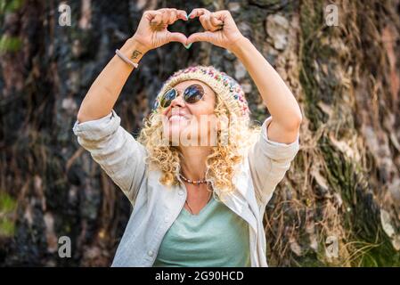 Gesturing heart, love, happy mature man in glasses smile standing ...