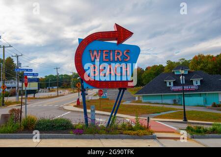 Entrance sign of Weirs Beach with neon lights in village of Weirs Beach ...