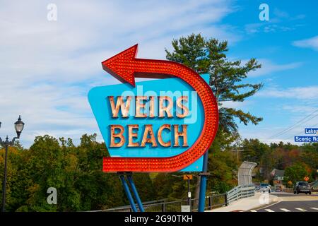 Entrance sign of Weirs Beach with neon lights in village of Weirs Beach ...